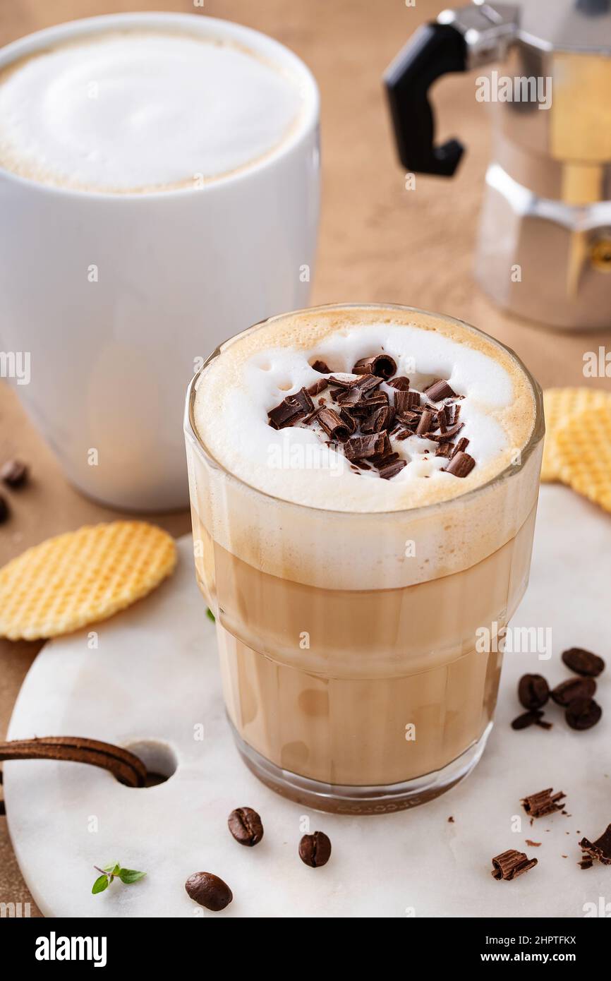 Hot coffee latte and cappuchino in a glass and mug Stock Photo - Alamy
