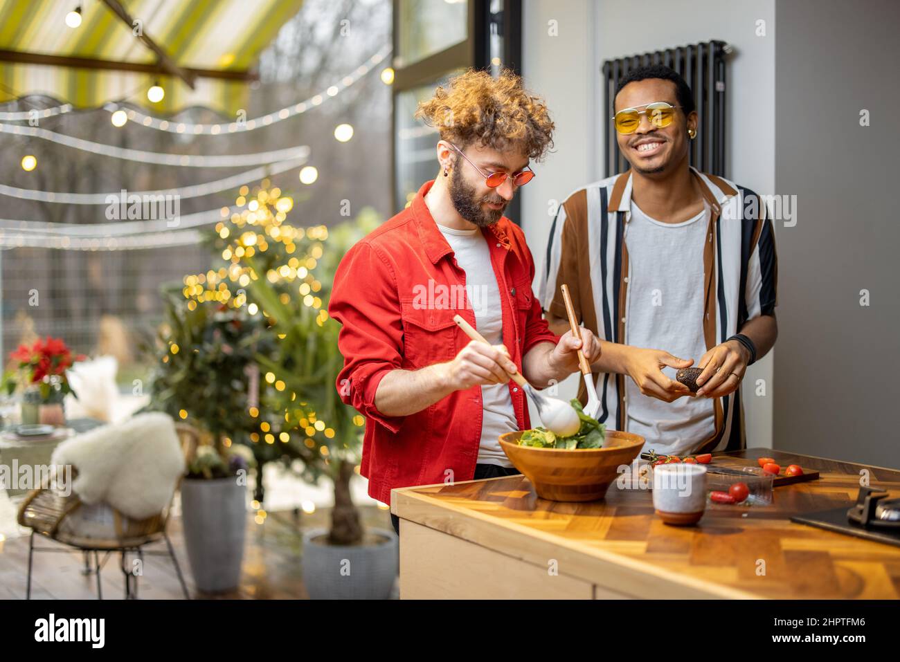 Two guys cooking healthy together at home Stock Photo - Alamy