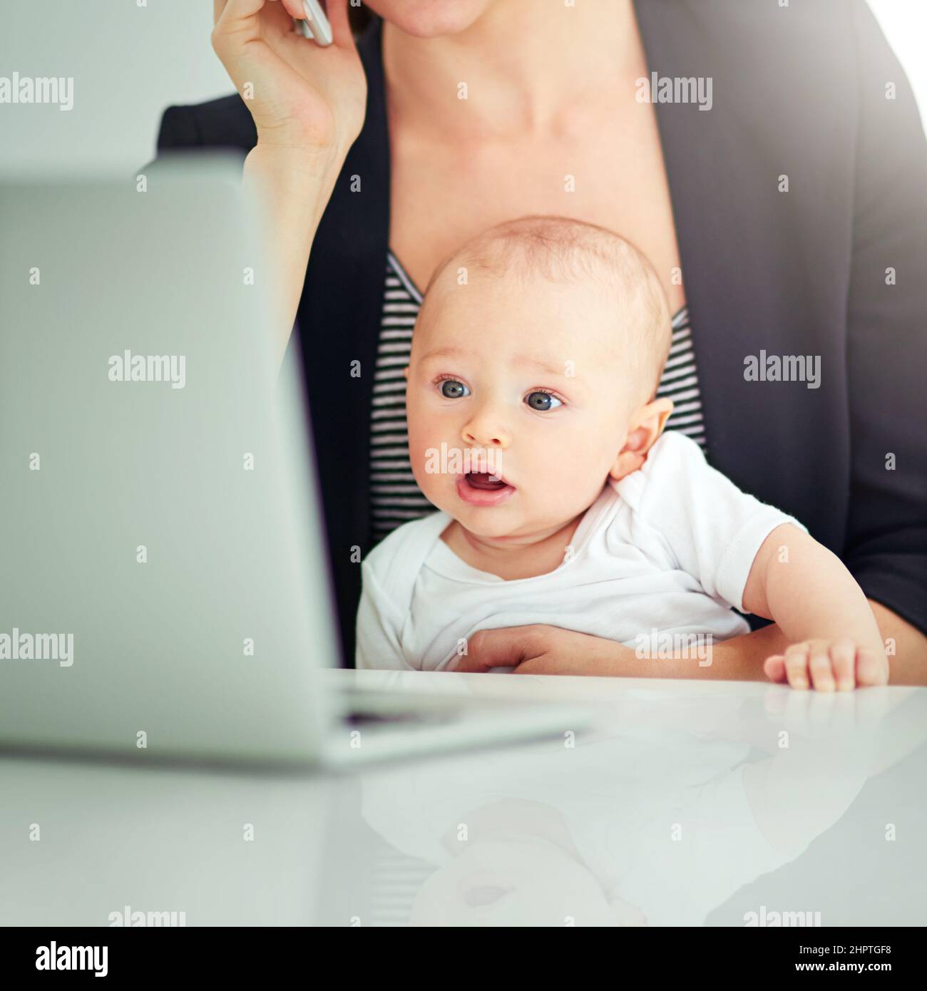 Whatcha working on there, Mom. Shot of an adorable baby boy curious ...