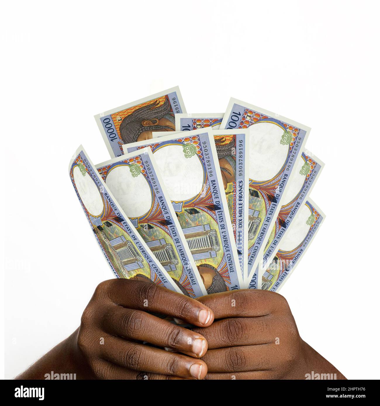 Black hands holding 3D rendered 10000 Central African Cfa franc notes ...