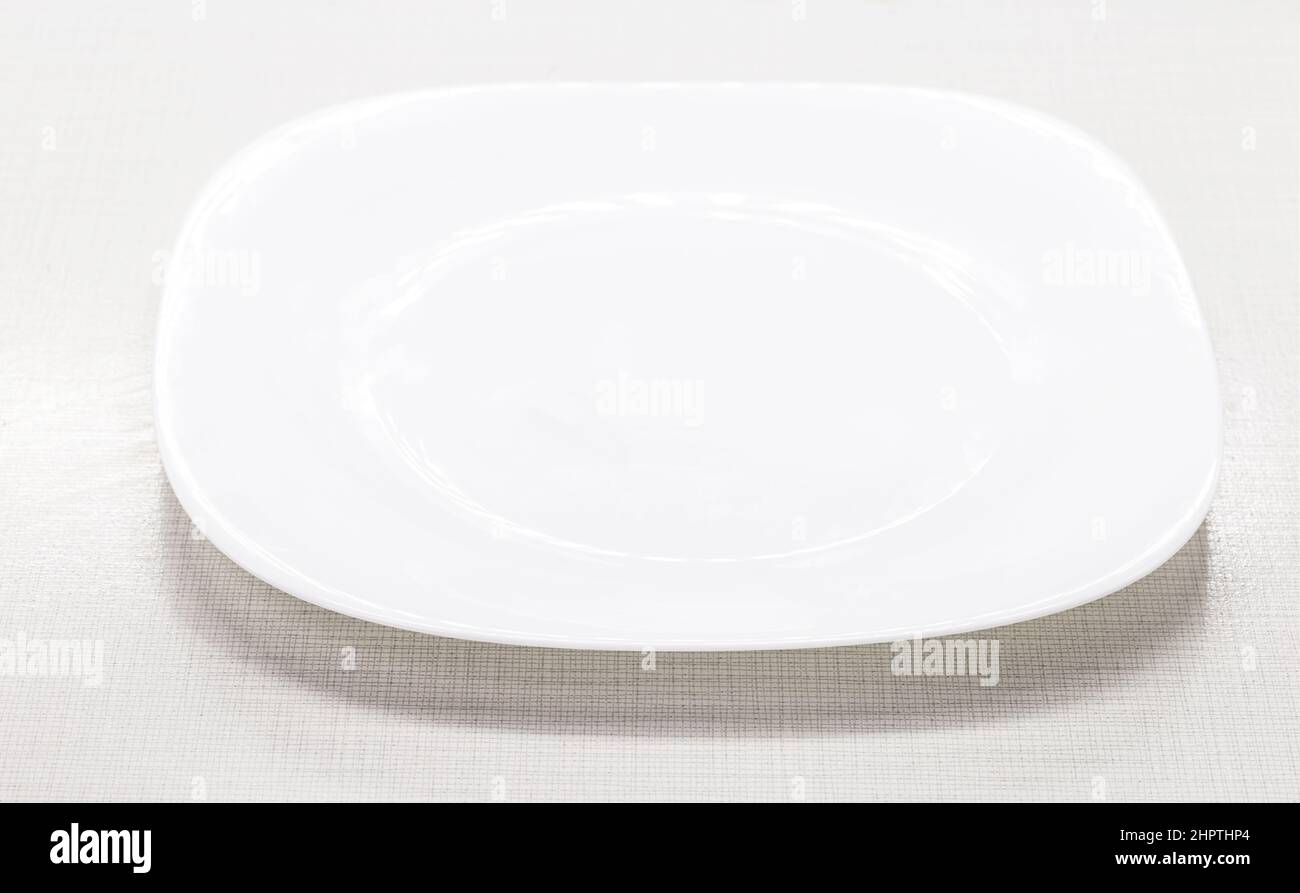 modern empty plastic plate mockup, on kitchen table, space for text ...