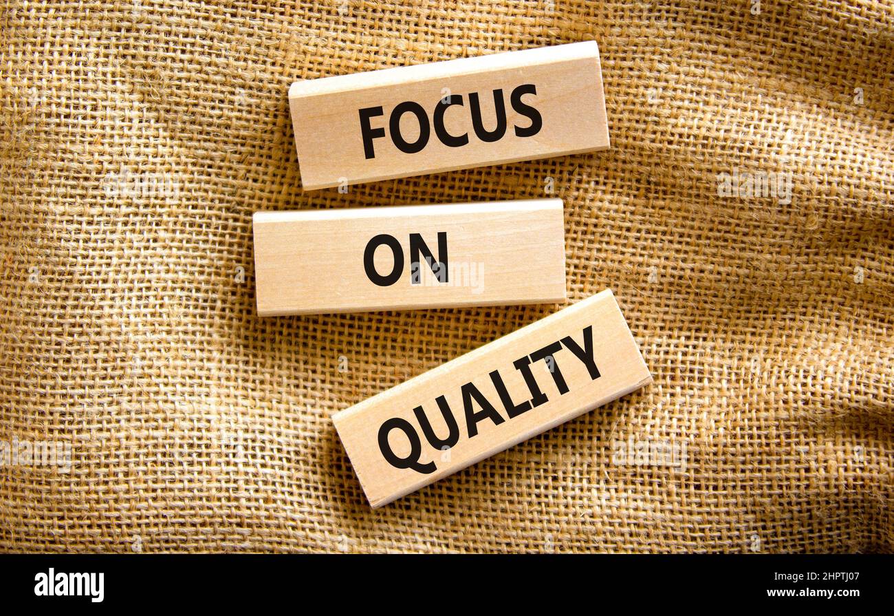 Focus on quality symbol. Concept words Focus on quality on blocks on ...