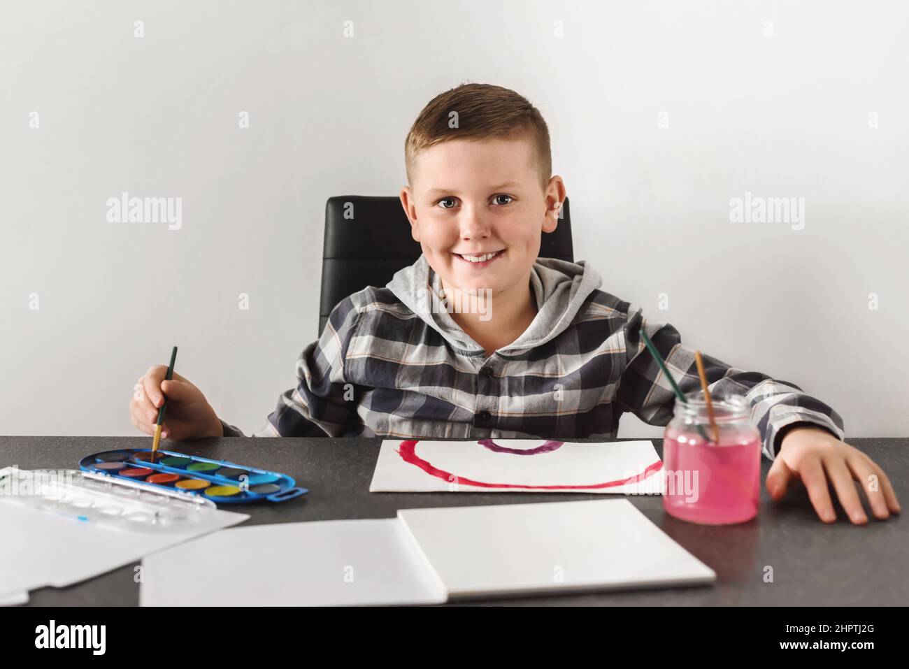 Boy Drawing With Brushes At Home Stock Photo - Alamy