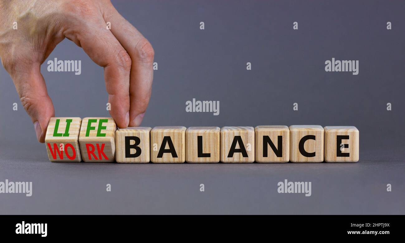 Work life balance symbol. Businessman turns cubes and changes concept ...