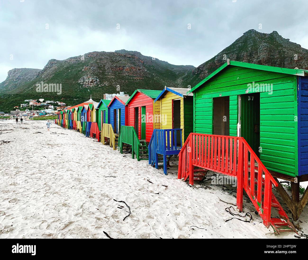 Colorful small beach hotels at a beach during the day Stock Photo - Alamy