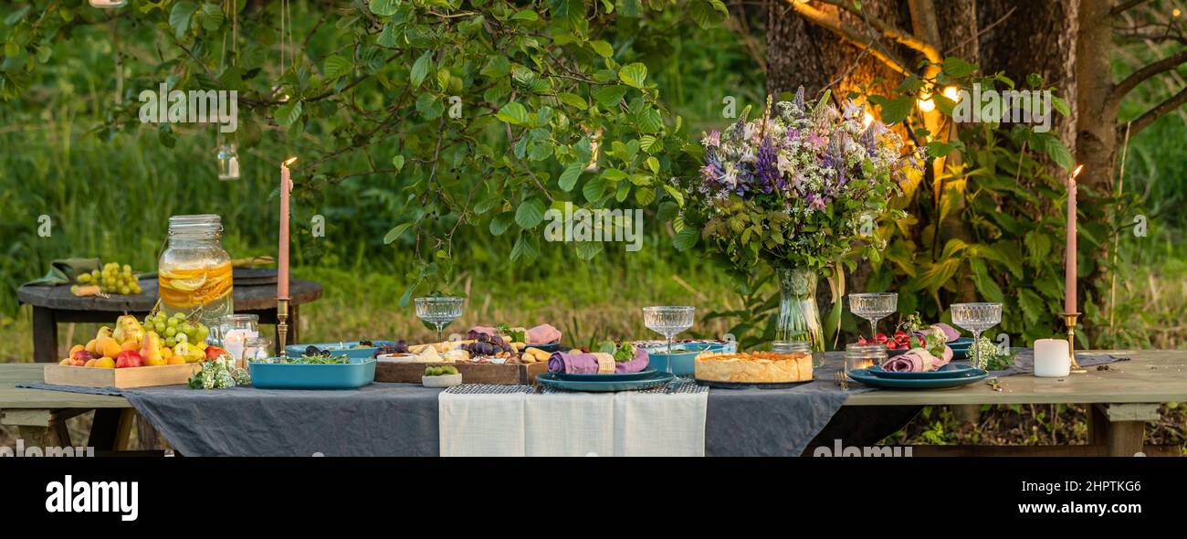 Summer evening romantic dinner outside. Golden organic healthy crispy ...