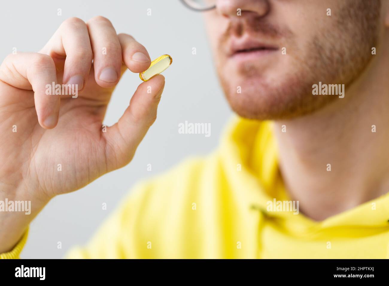 Smiling man takes vitamins. Closeup. Healthcare and medicine Stock ...