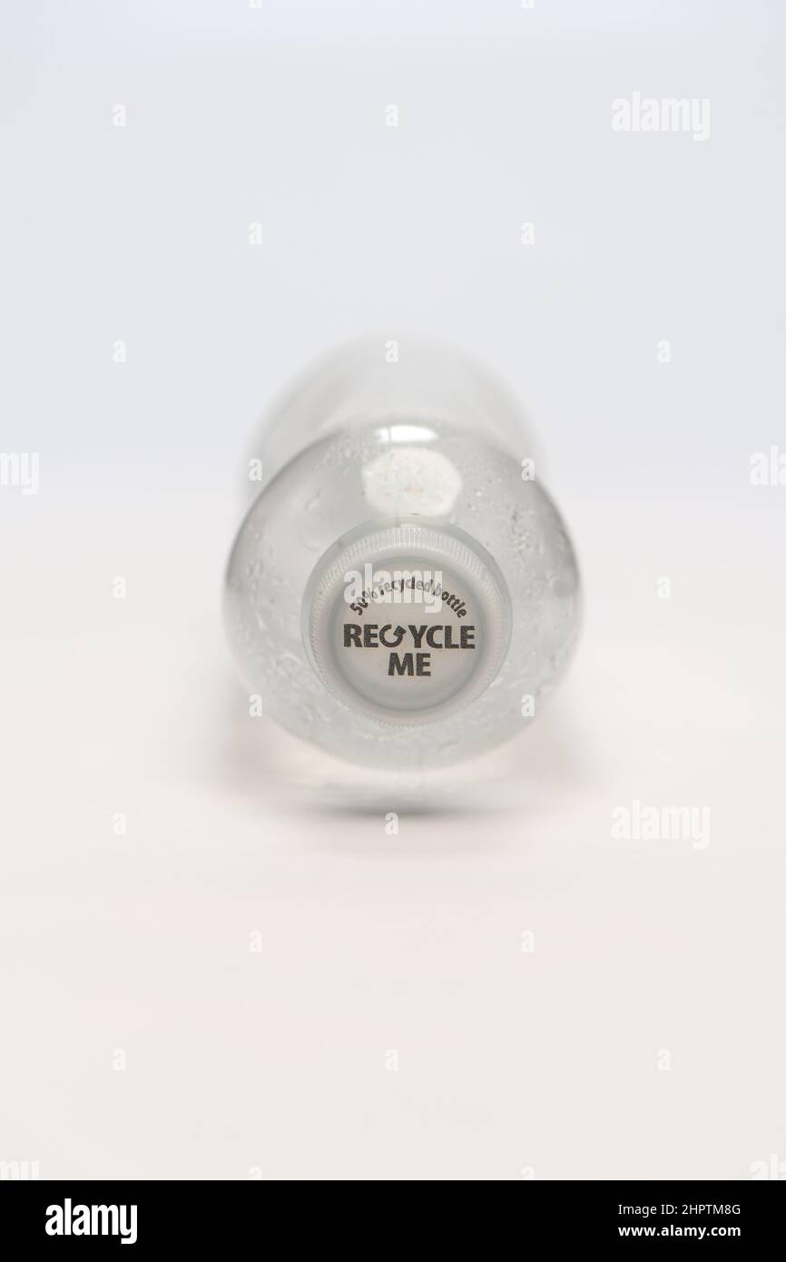 A single use bottle showing cap that has recycle me printed on to it ...