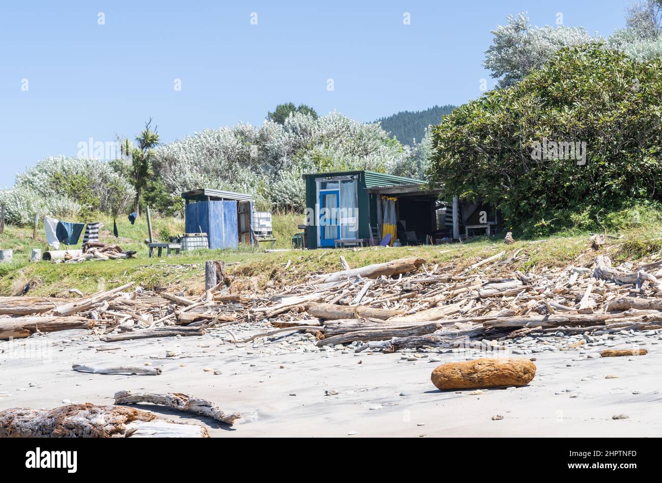 beach dwellings on scenic long beach at Waipiro Bay on East Coast ...