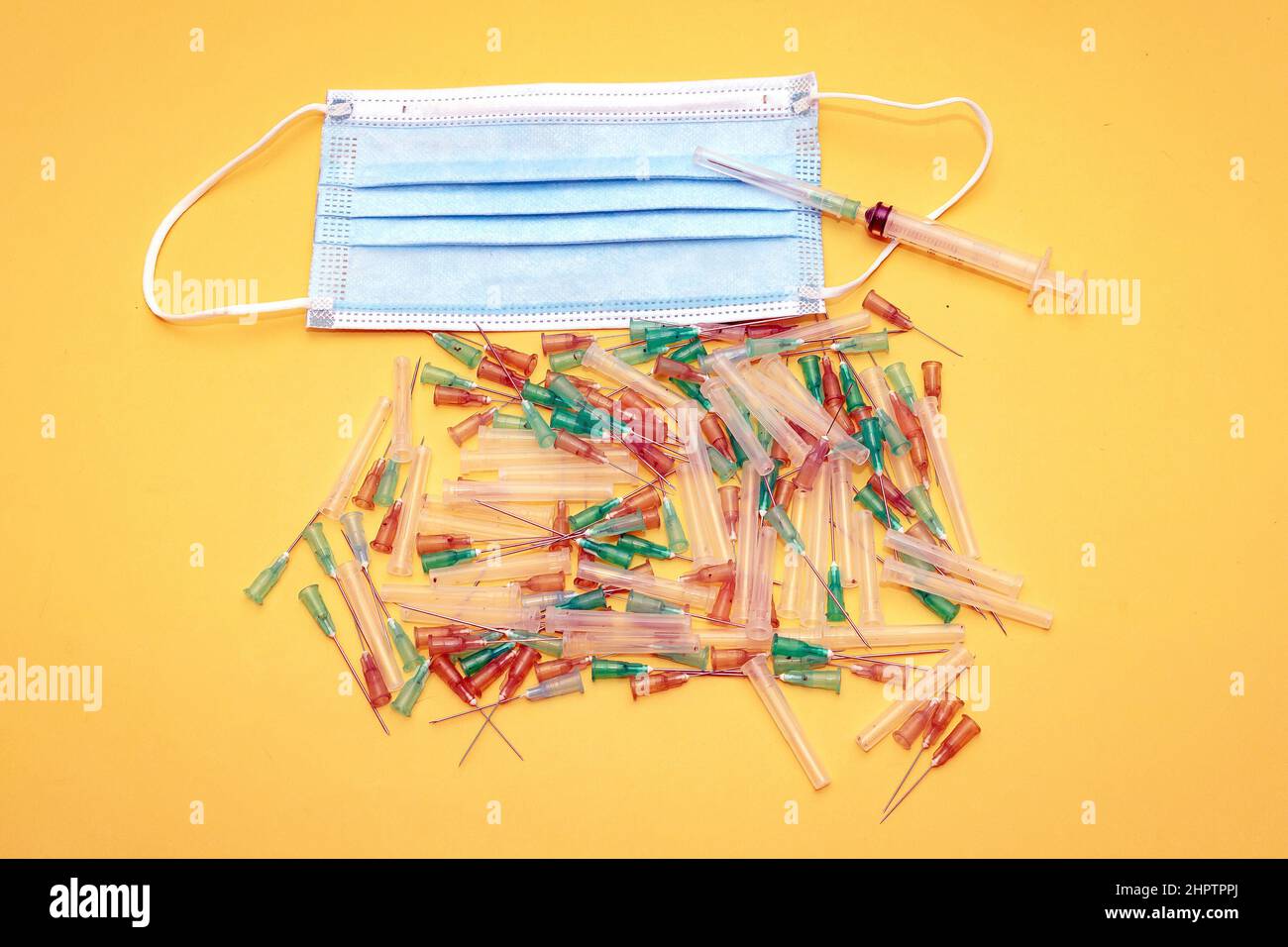 Pile of used needles toxic medical waste with injection syringe and ...