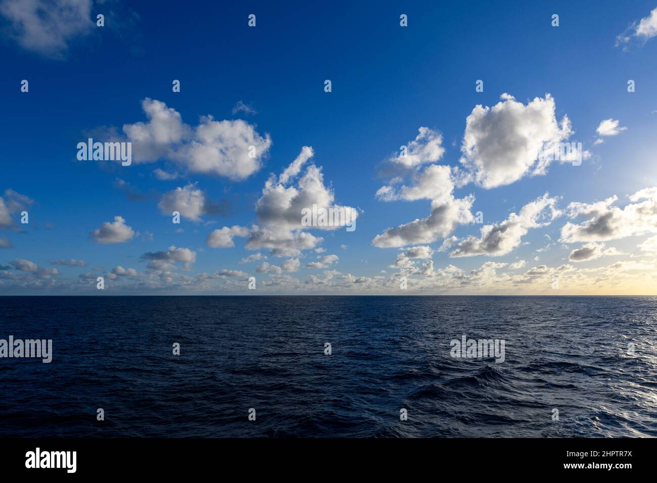 Seascape, blue sea. Sunset at sea. Calm weather. View from cargo vessel ...