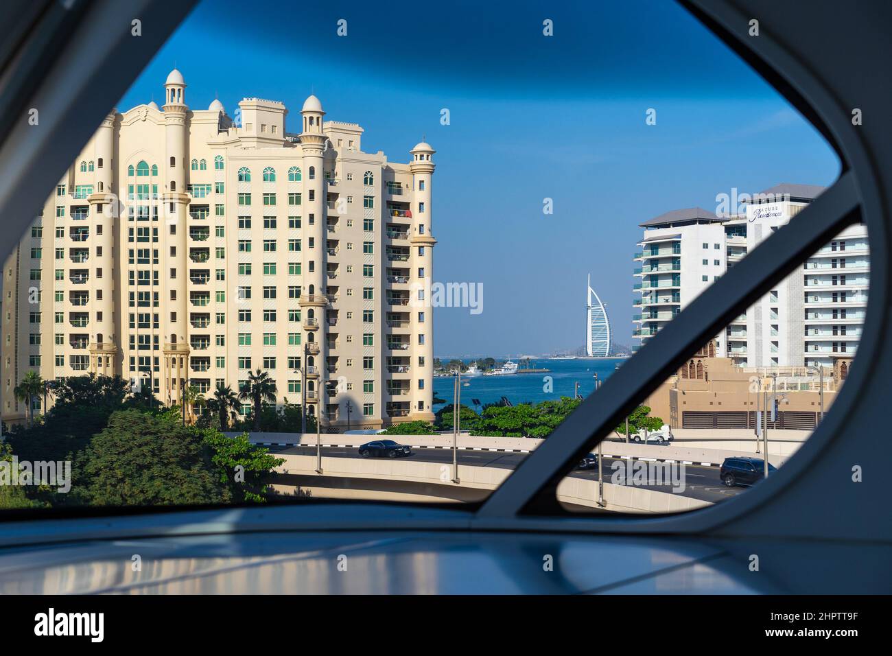 View of tall residential buildings from the window of the Dubai Palm ...