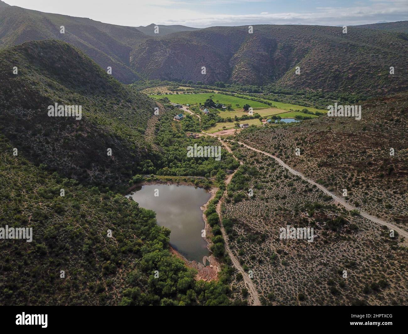 Farm in valley Stock Photo - Alamy