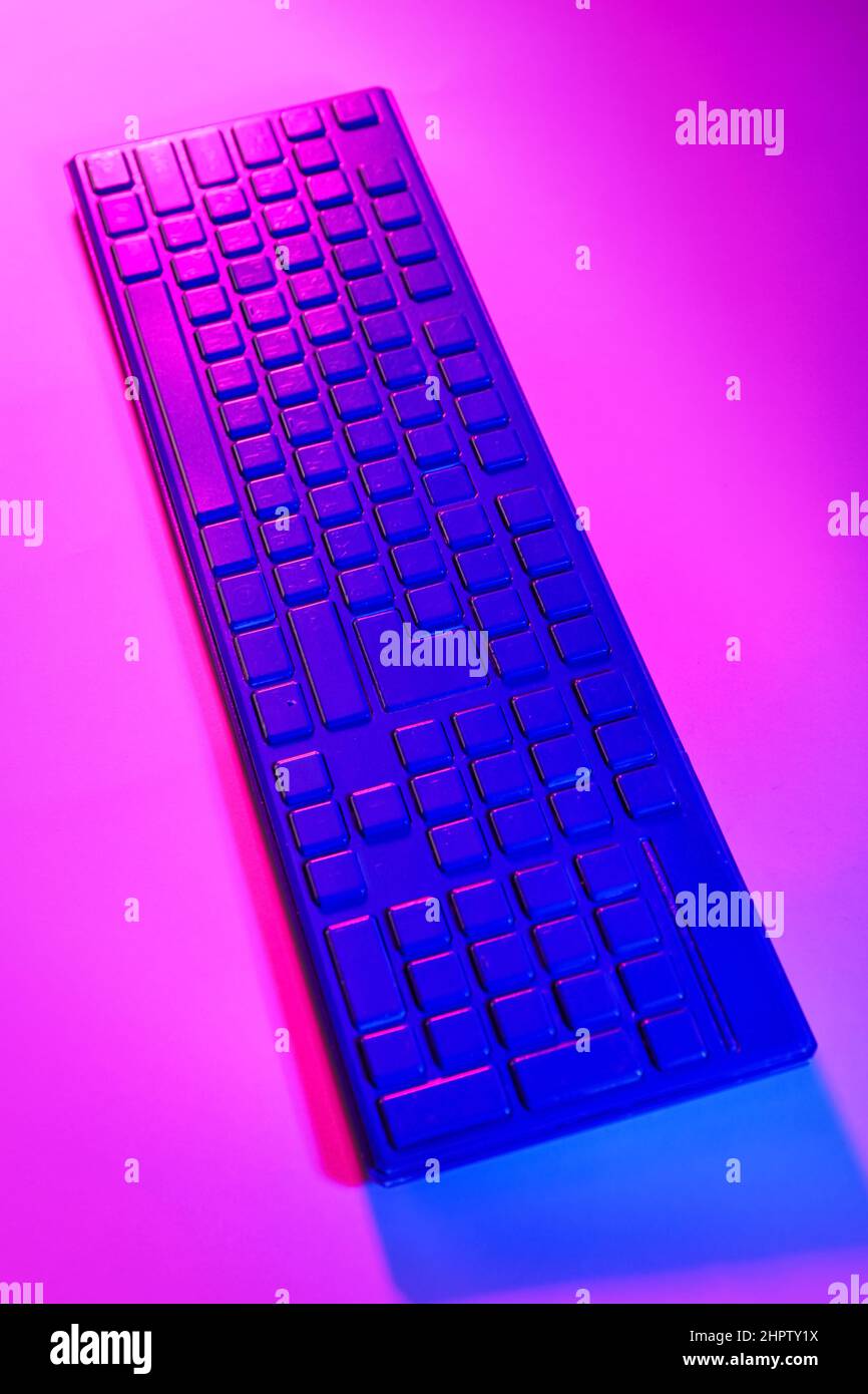 Modern computer keyboard on dark color background Stock Photo - Alamy