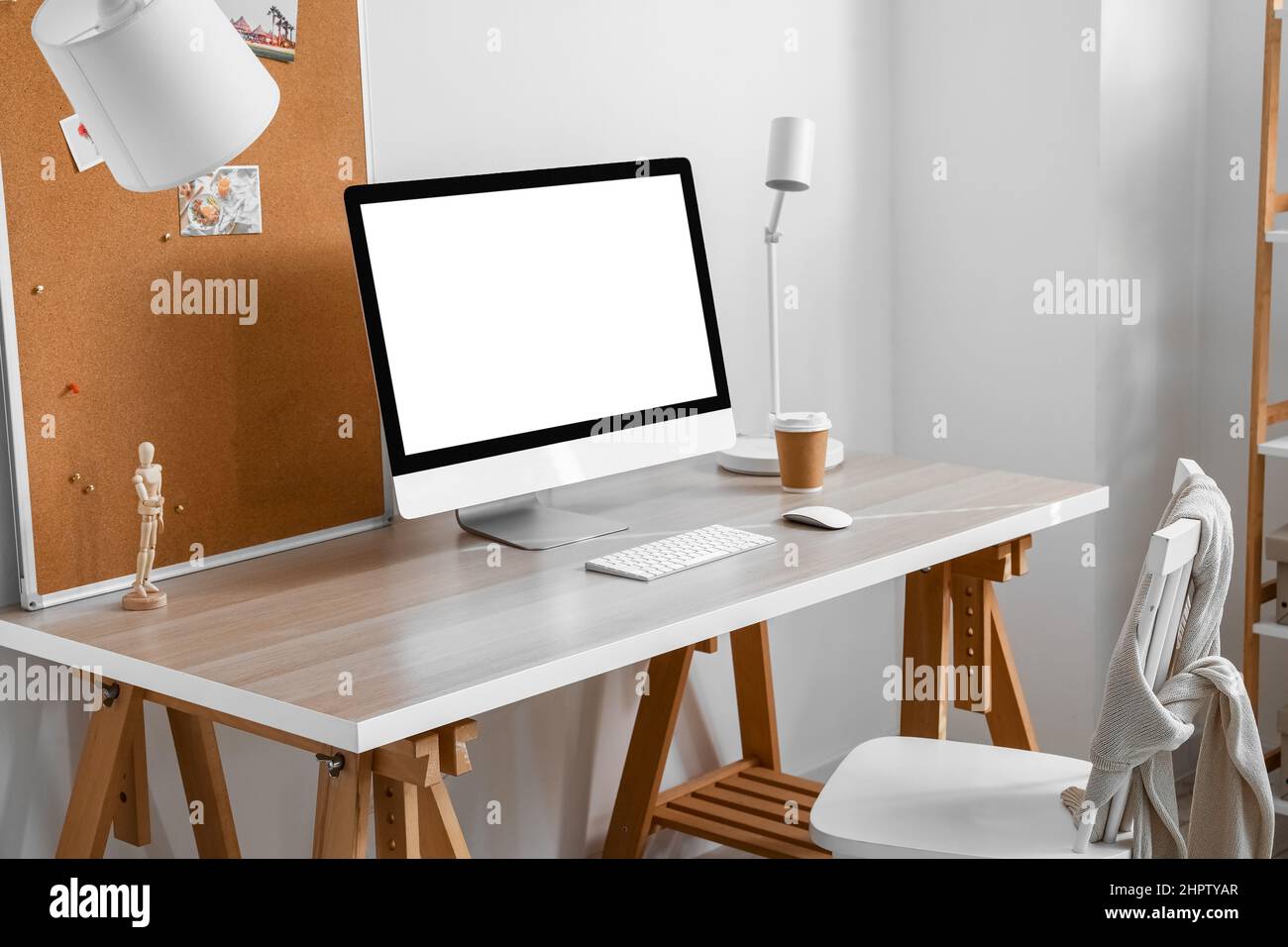 Interior of light office with modern workplace, computer and lamp Stock ...