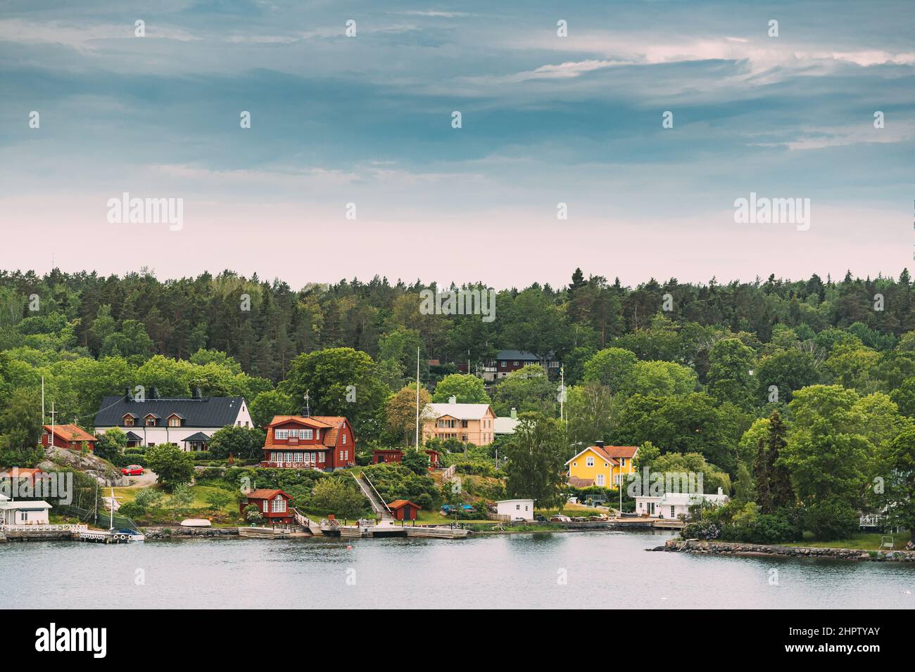 Sweden. Beautiful Red Swedish Wooden Log Cabin House On Rocky Island ...