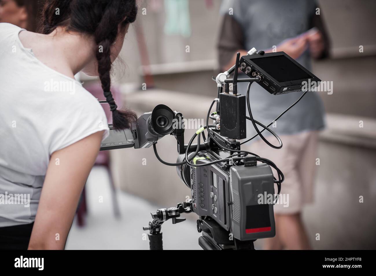 Behind the scenes. Cameraman shooting the film scene with camera on ...