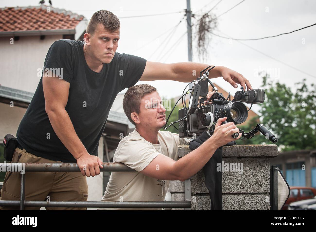 Behind the scenes. Cameraman shooting the film scene with camera on ...