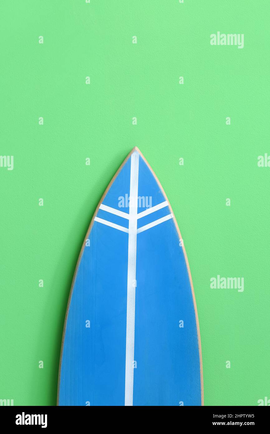 Modern surfboard near green wall Stock Photo - Alamy