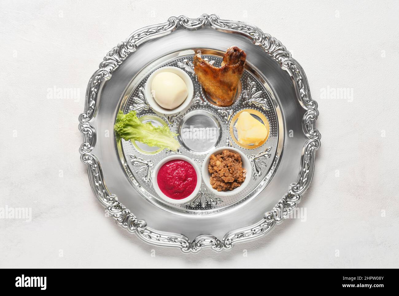 Passover Seder plate with traditional food on white background Stock ...