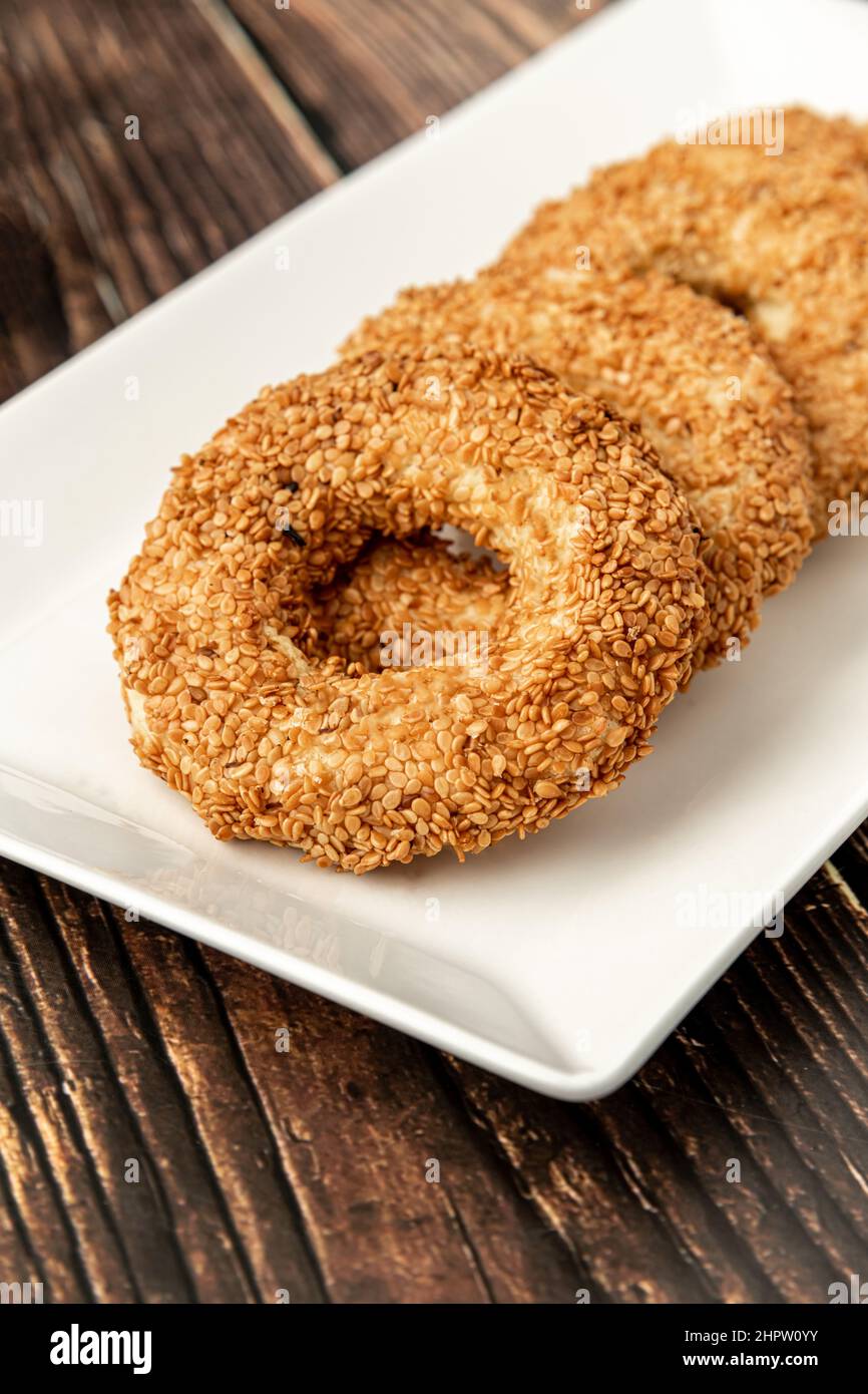 Turkish name Kandil simidi with tea beside it on wooden table. Turkish ...