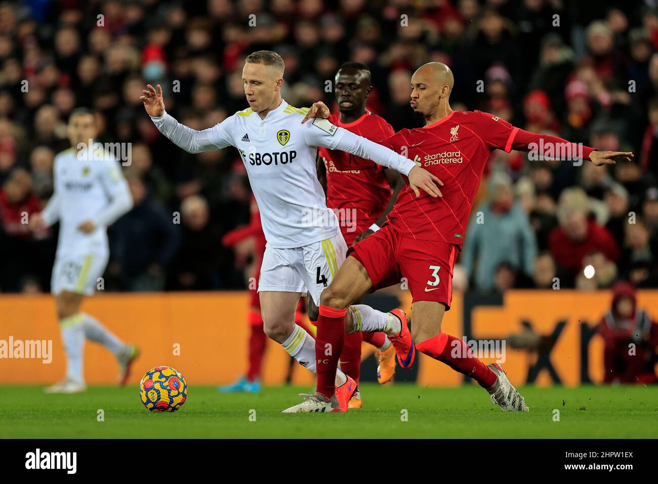Adam Forshaw #4 of Leeds United is tackled by Fabinho #3 of Liverpool ...