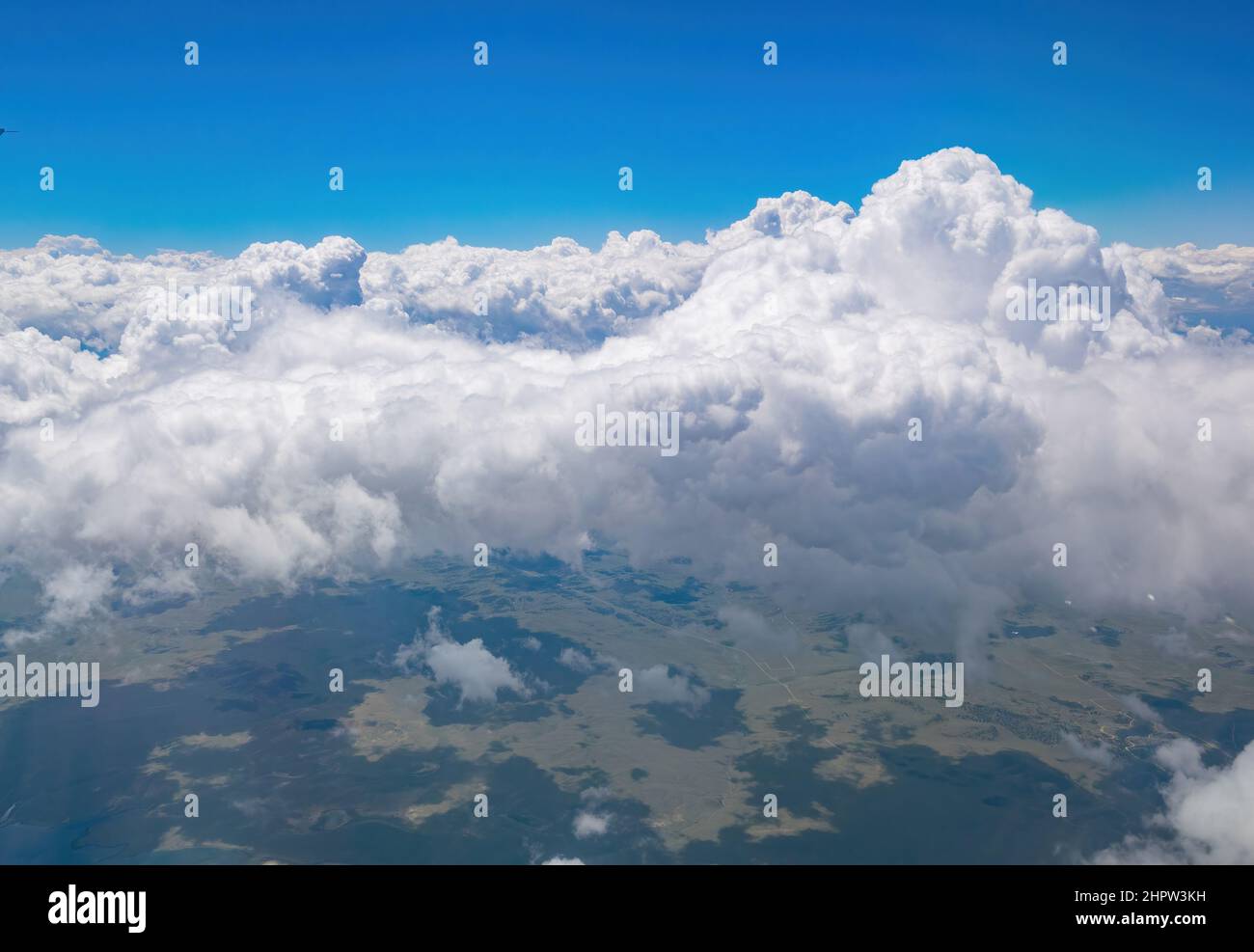 Aerial view of mountain landscape, view from window seat in an airplane ...