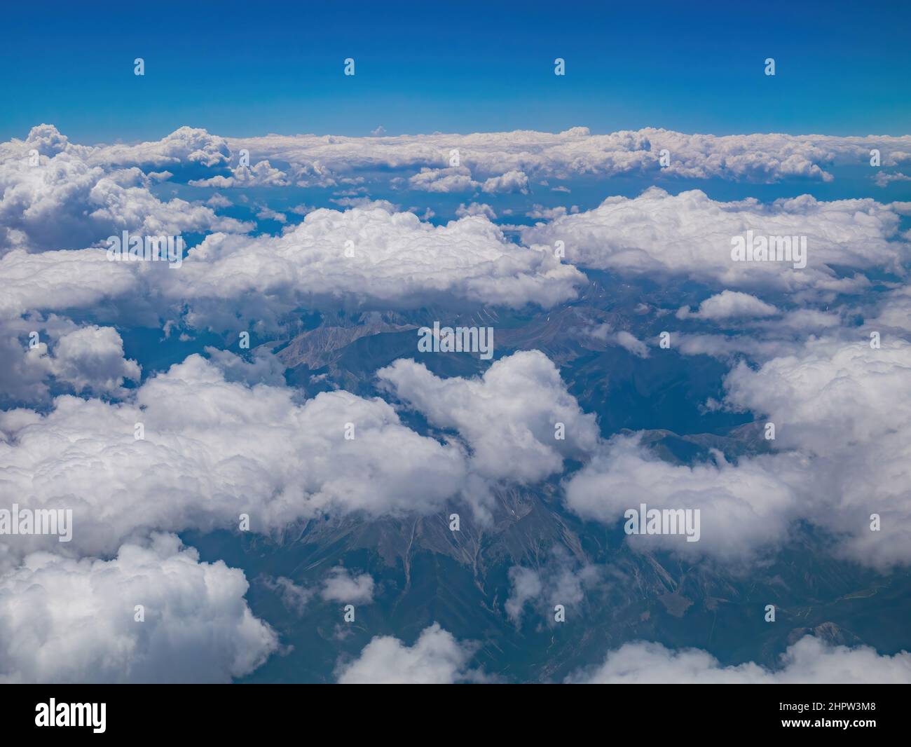 Aerial view of mountain landscape, view from window seat in an airplane ...