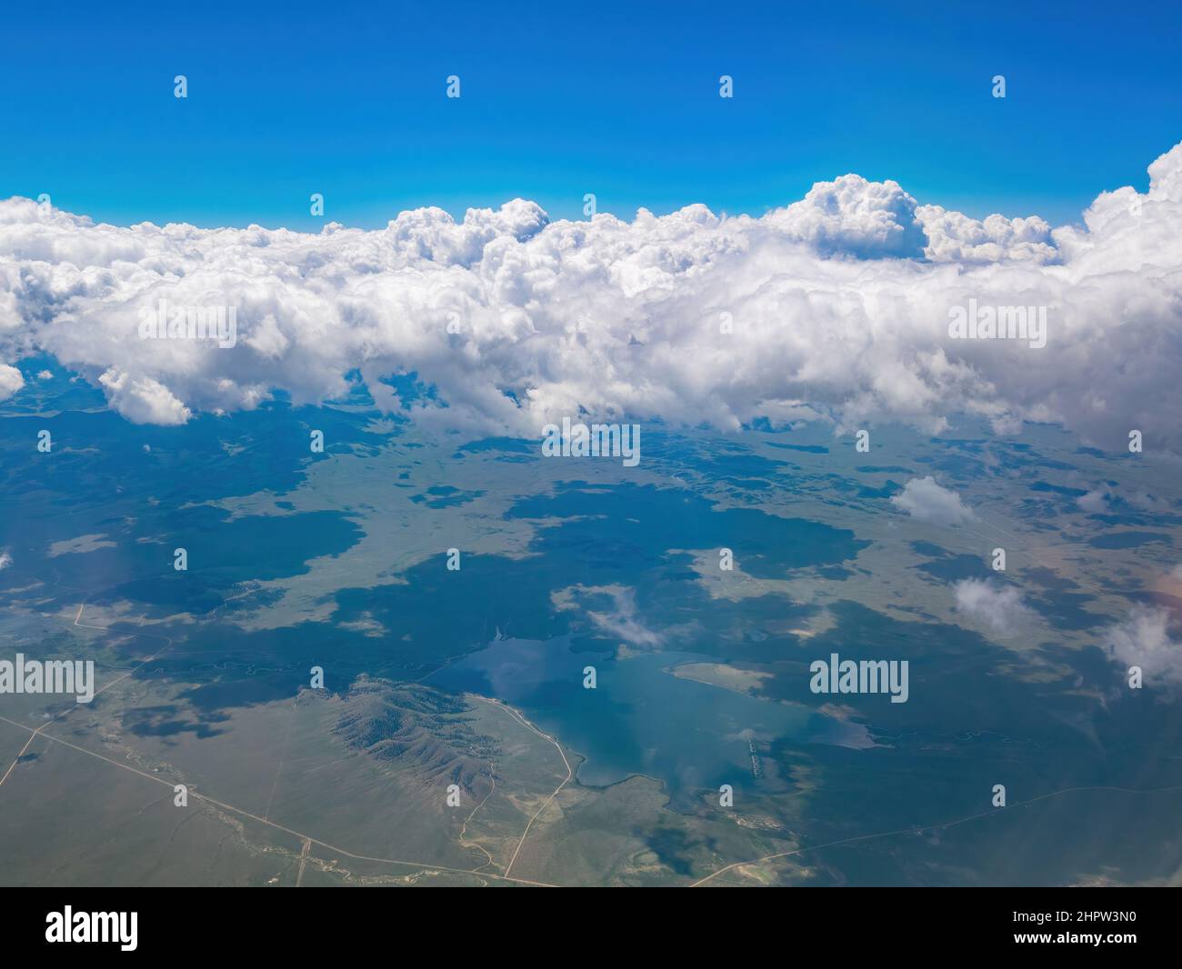 Aerial view of mountain landscape, view from window seat in an airplane ...