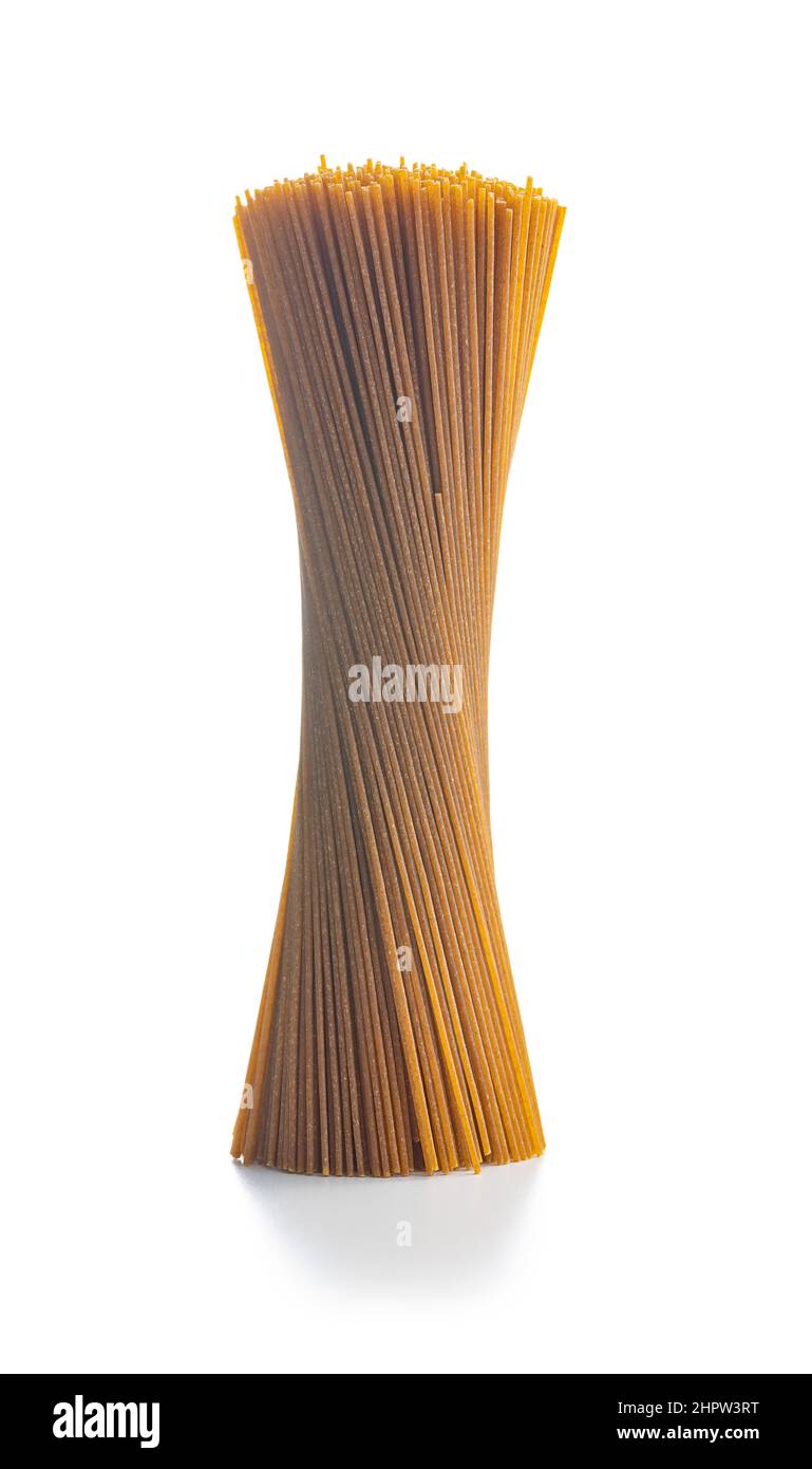 Uncooked whole grain spaghetti. Raw pasta isolated on a white ...