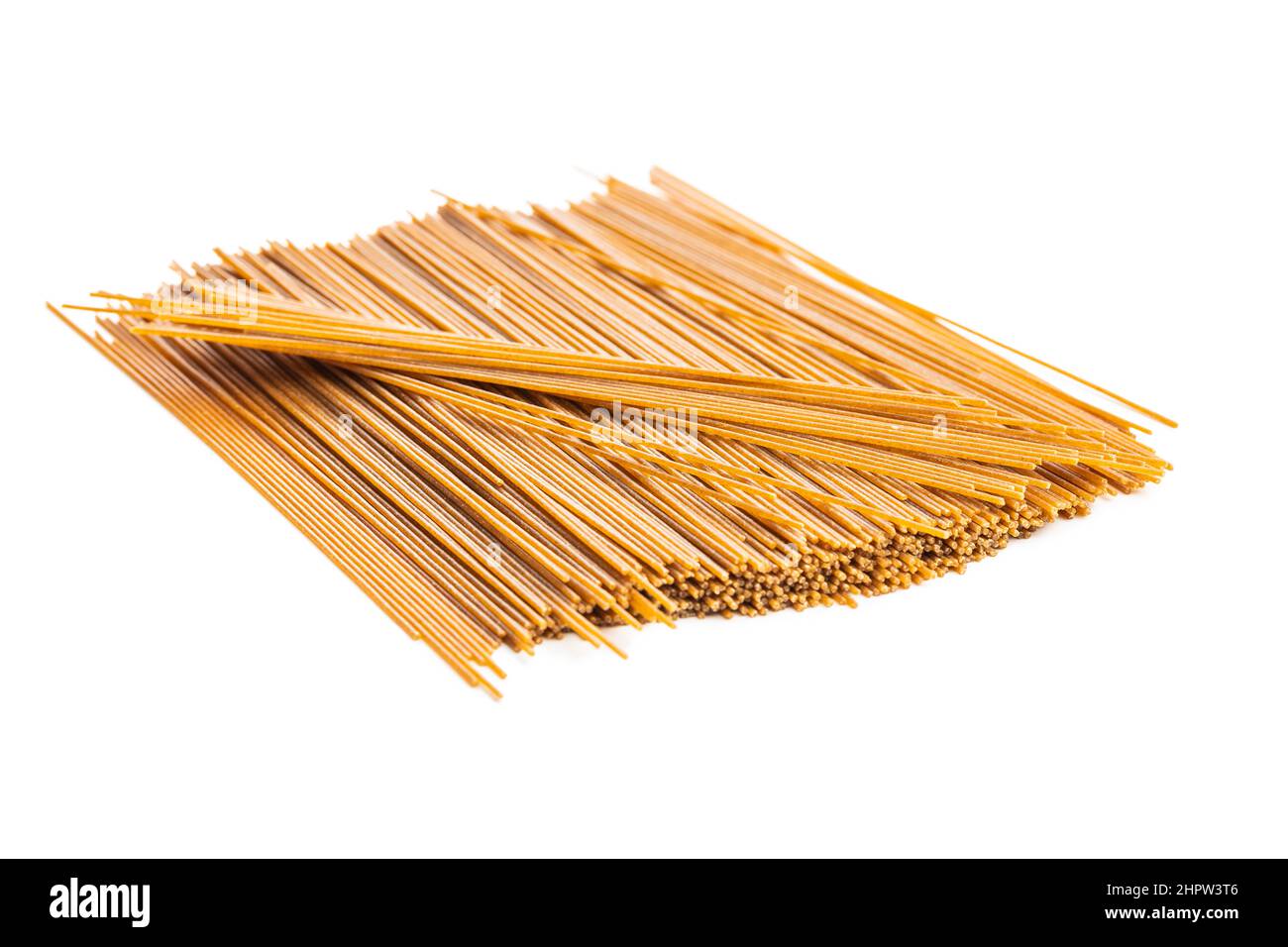 Uncooked whole grain spaghetti. Raw pasta isolated on a white ...