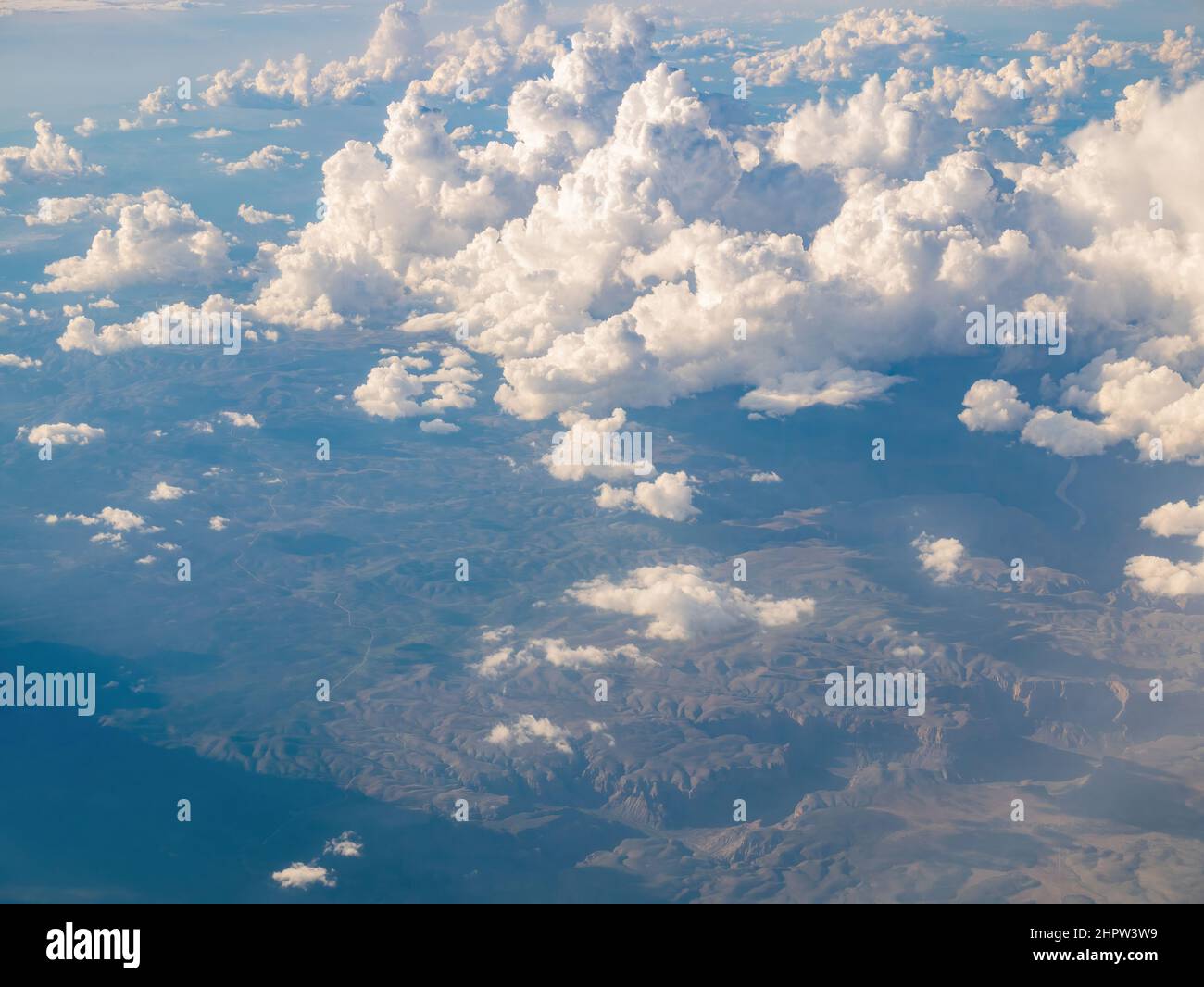 Aerial view of mountain landscape, view from window seat in an airplane ...