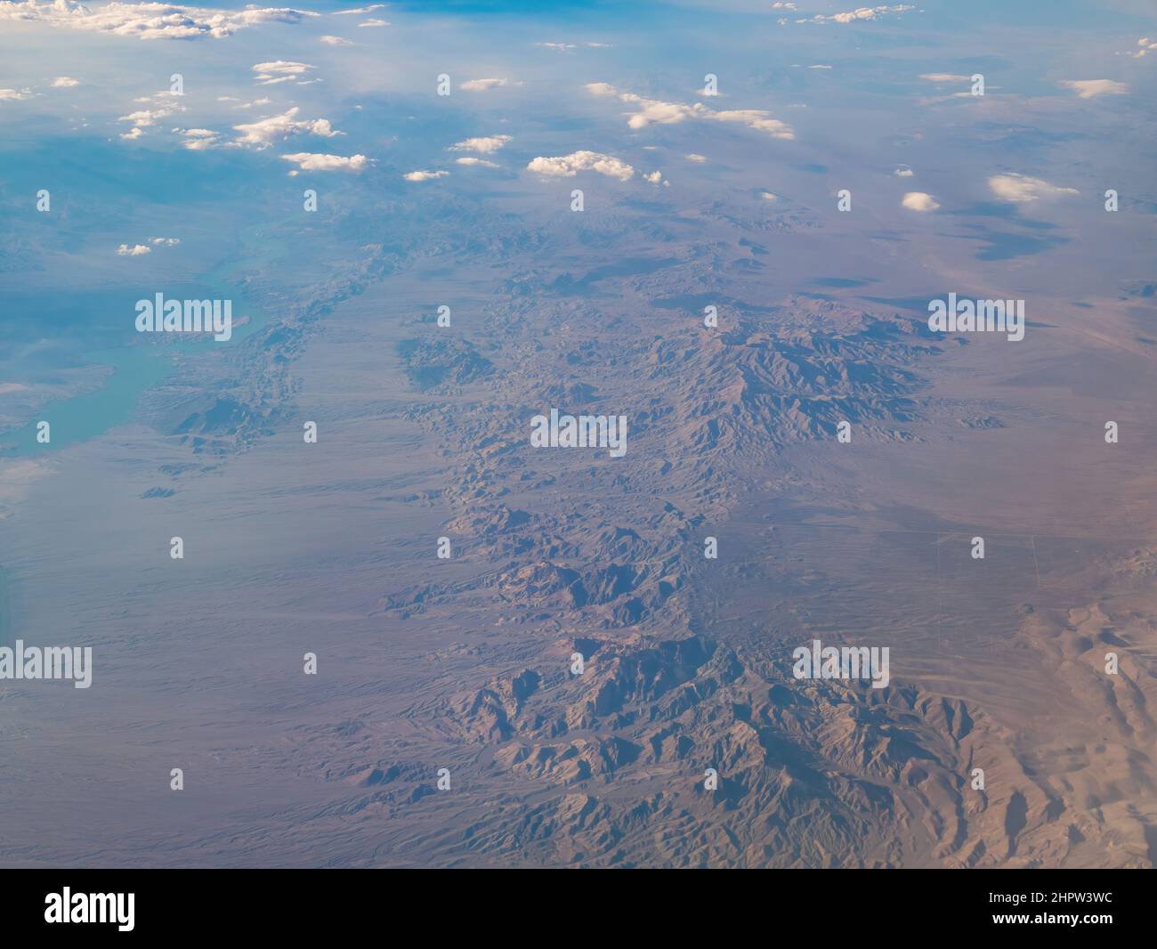 Aerial view of mountain landscape, view from window seat in an airplane ...