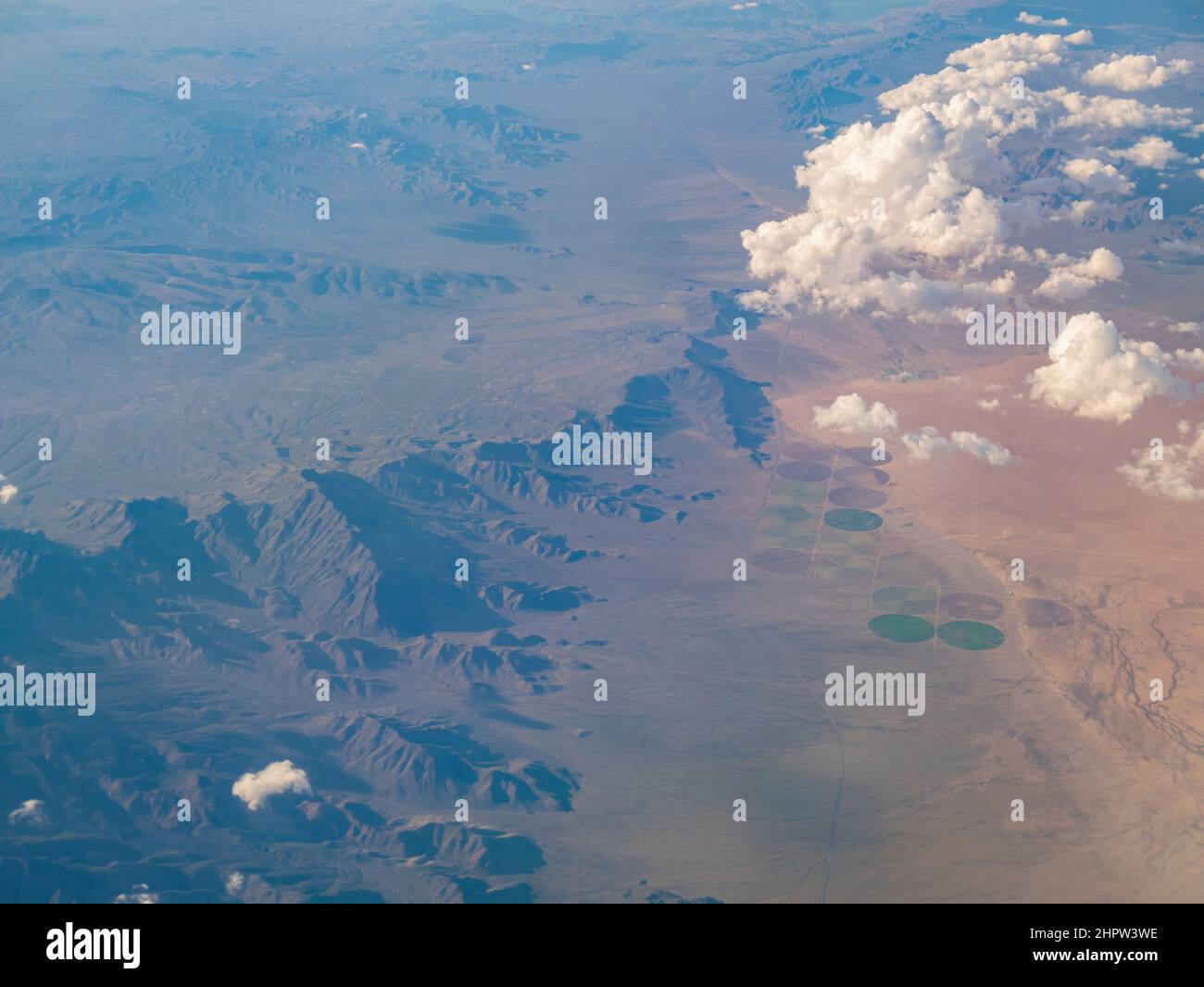 Aerial view of mountain landscape, view from window seat in an airplane ...