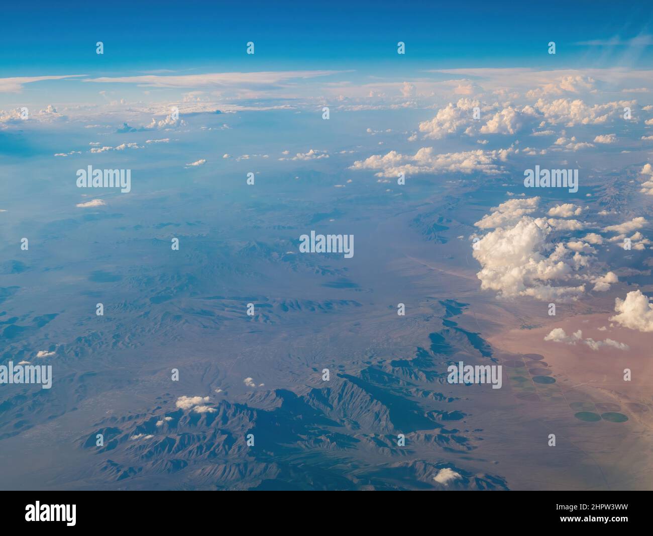 Aerial view of mountain landscape, view from window seat in an airplane ...