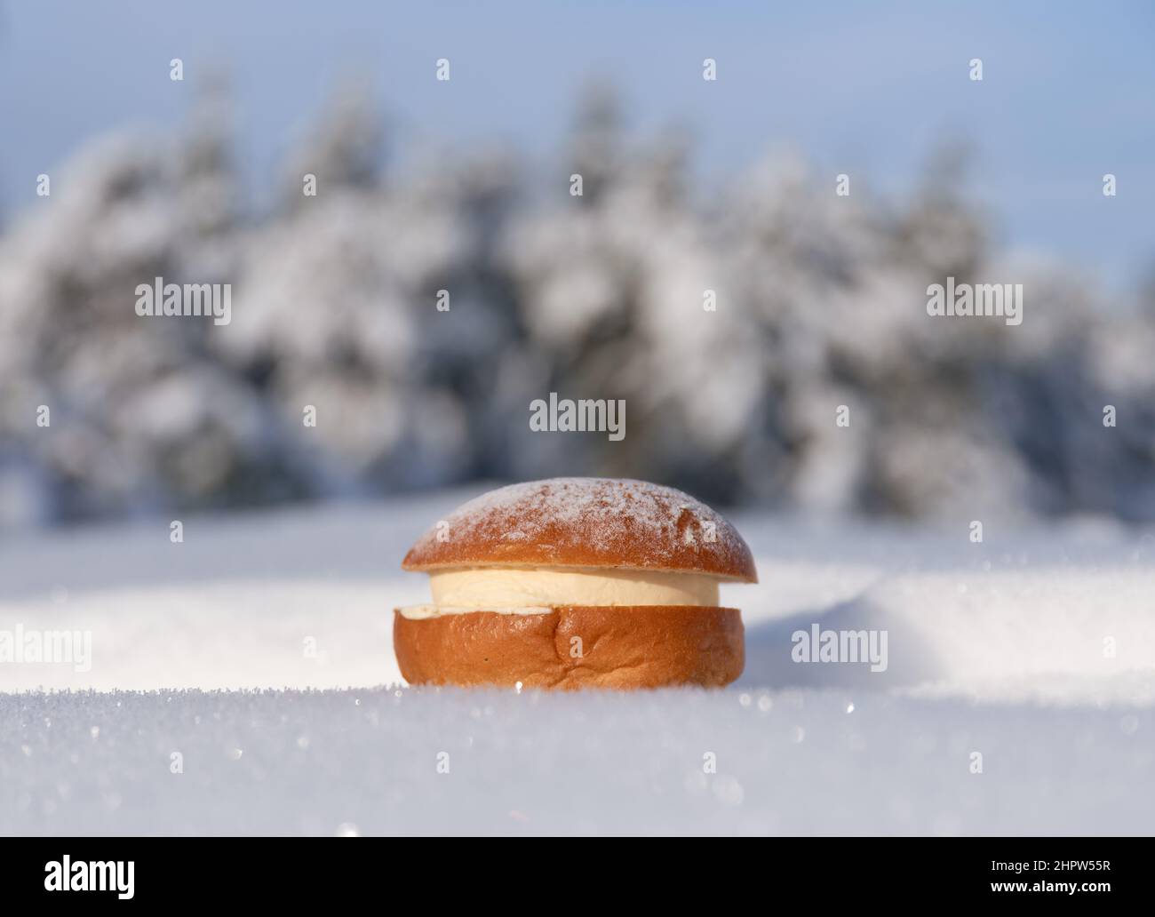 Traditional Finnish pre-Easter bun or lent bun fllled with cream and ...