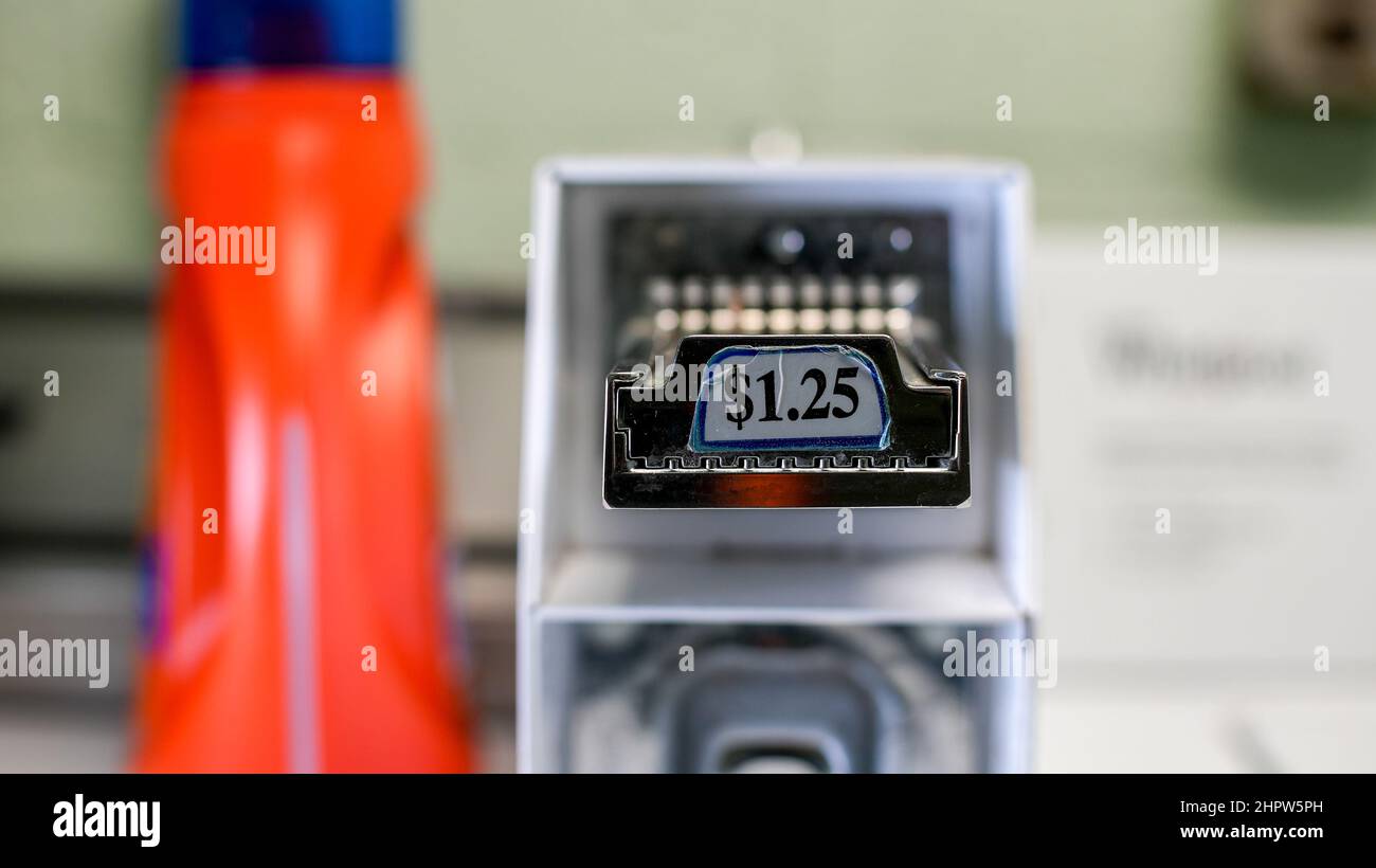 Close up from front view to dryer slot for coins Stock Photo - Alamy