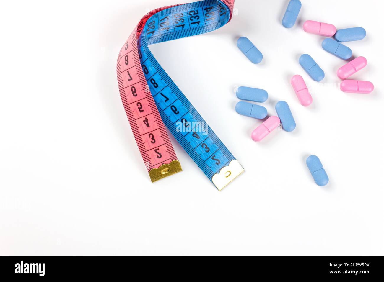 Pills measuring tape concept hi-res stock photography and images - Alamy