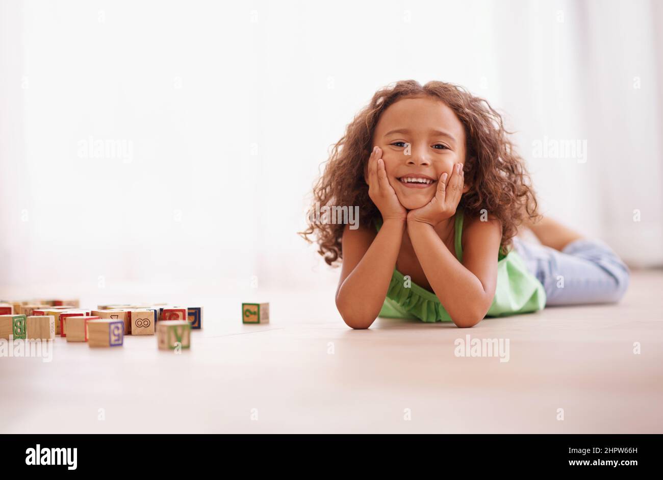 I think Ive mastered these alphabet blocks. Shot of a cute little girl ...