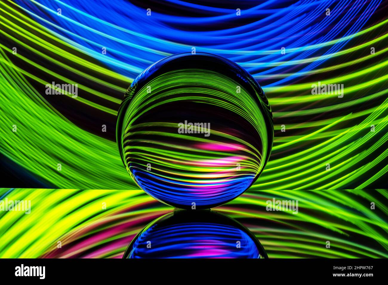 Lens ball with the multicolored reflection of the background lights ...