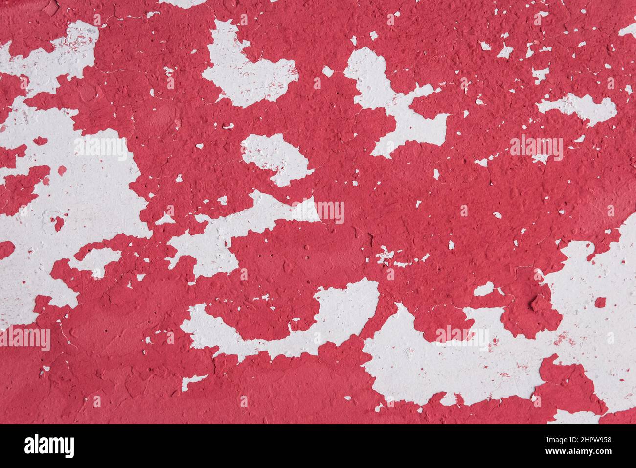 Red peeling paint abstract color pattern design worn weathered white wall surface texture ...
