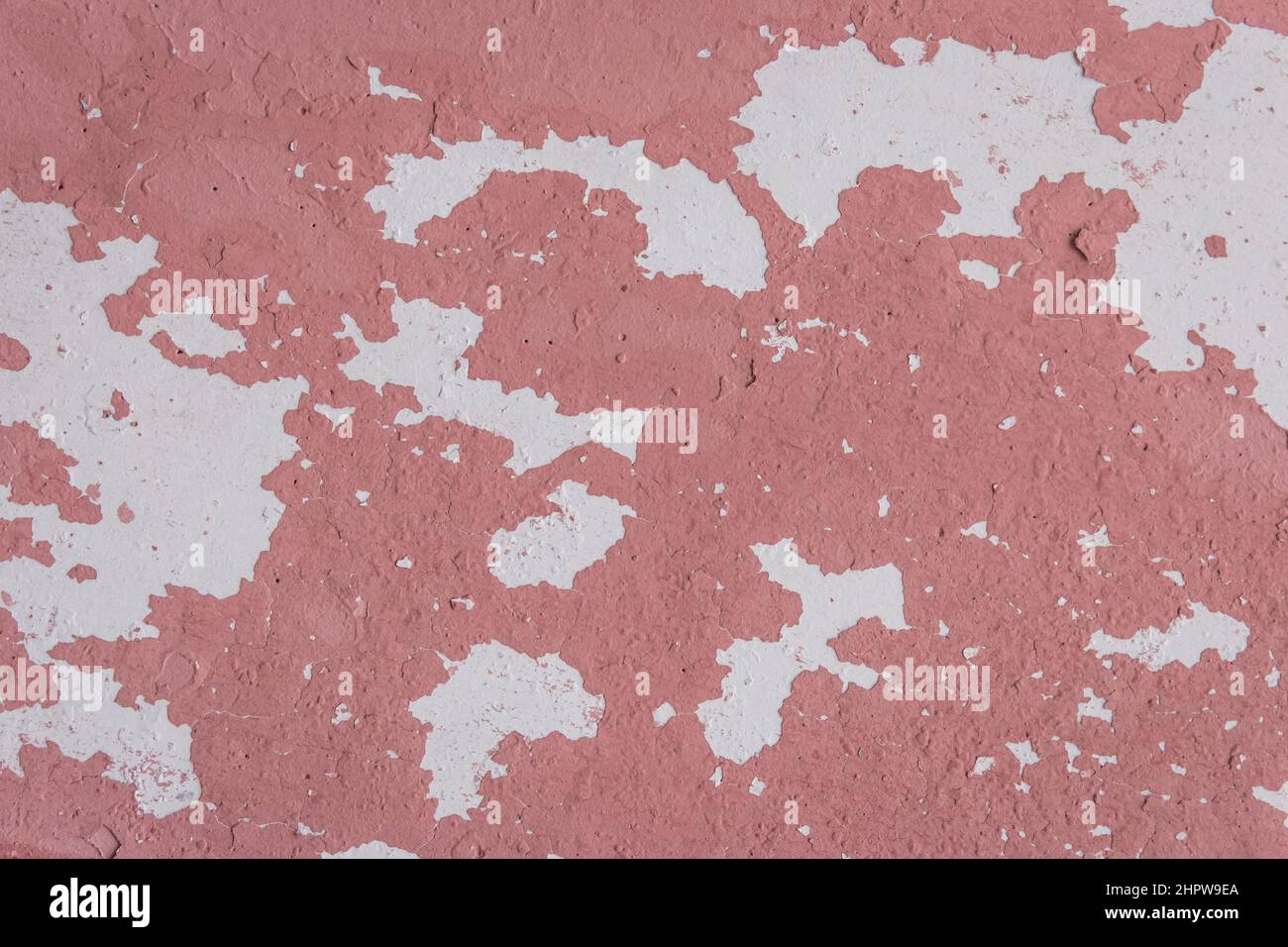 Red peeling paint abstract color pattern design worn weathered white wall surface texture ...
