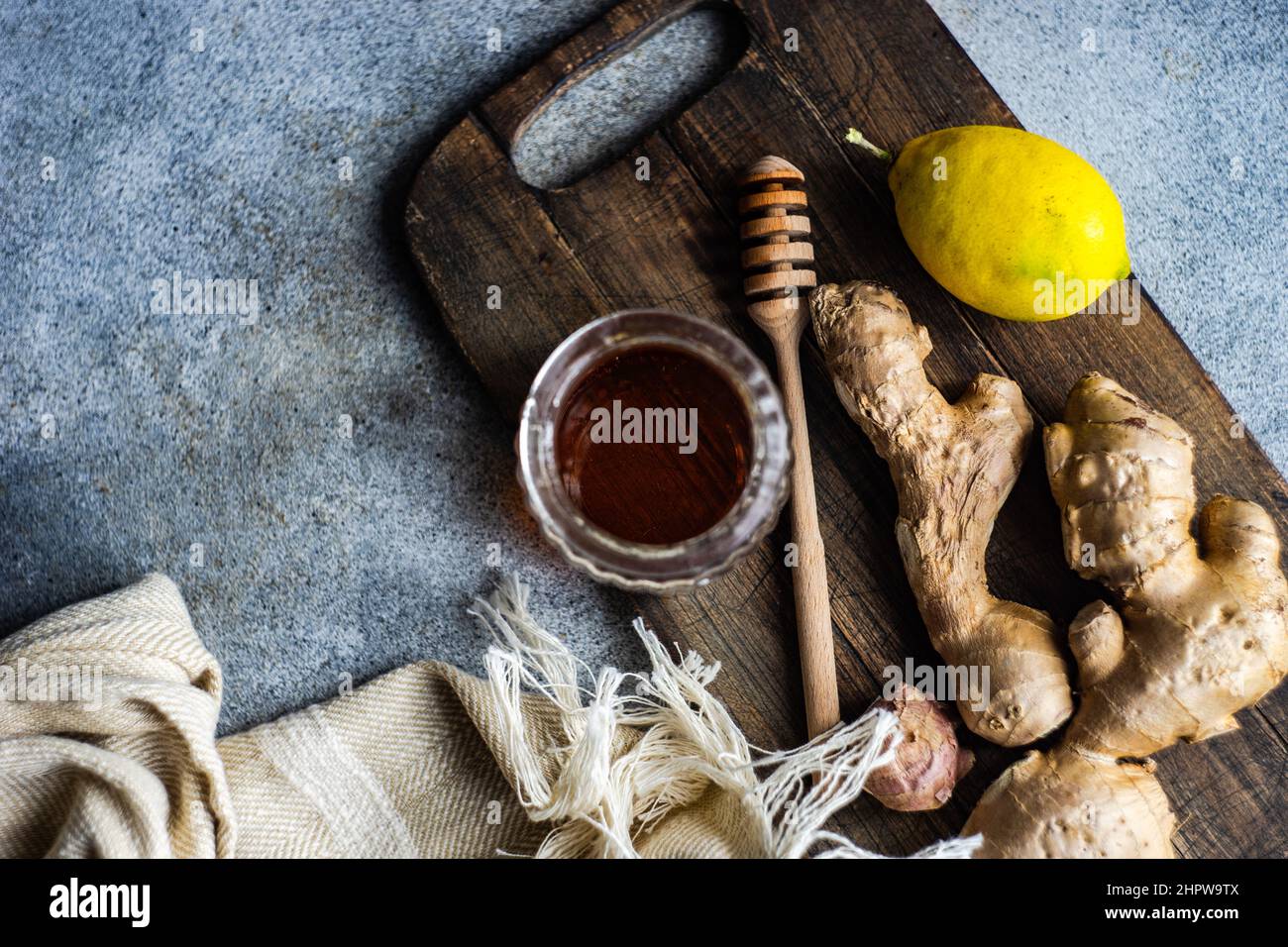 Ingredients for healthy tea with fresh lemon, ginger root and honey ...