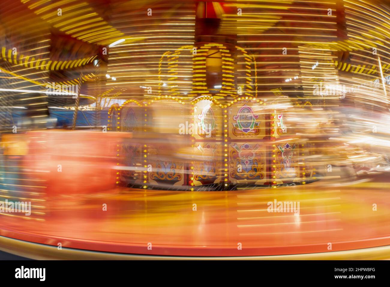 Long exposure of a colourful spinning carousel fairground ride Stock ...