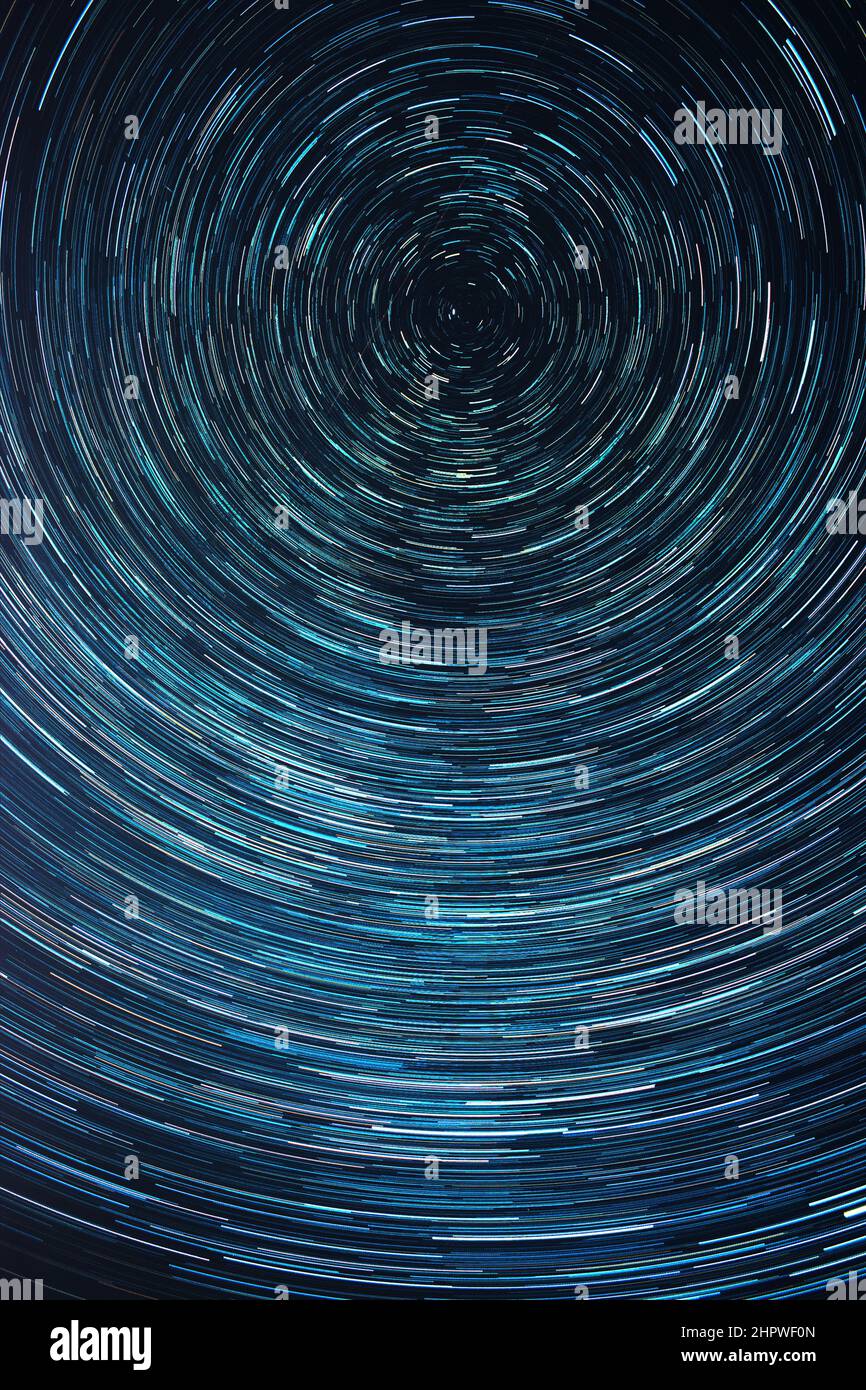 Vertical photo of star trails focused towards Earth's north pole Stock ...