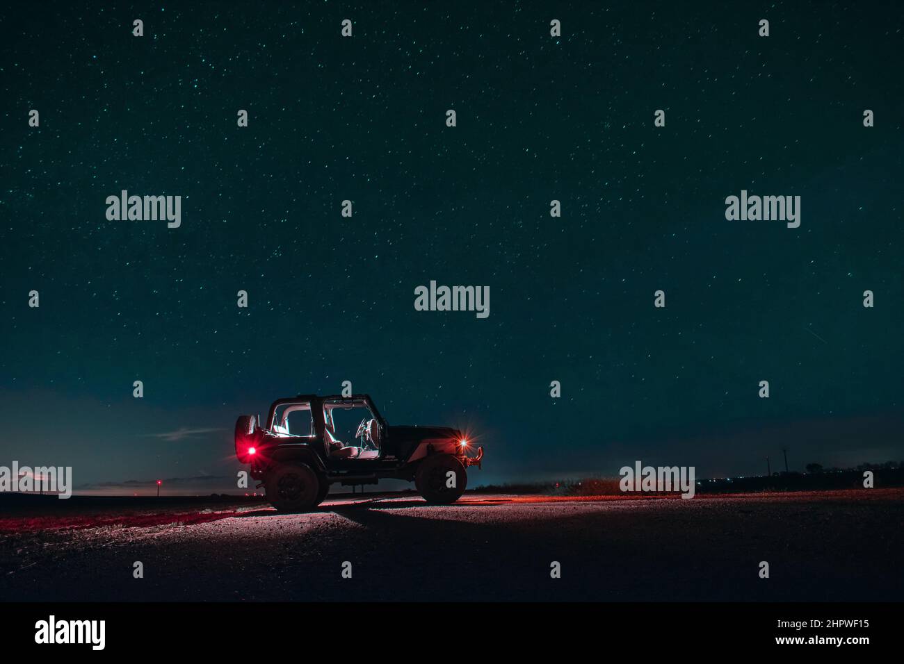 Black Jeep Wrangler parked underneath the starry night sky Stock Photo ...