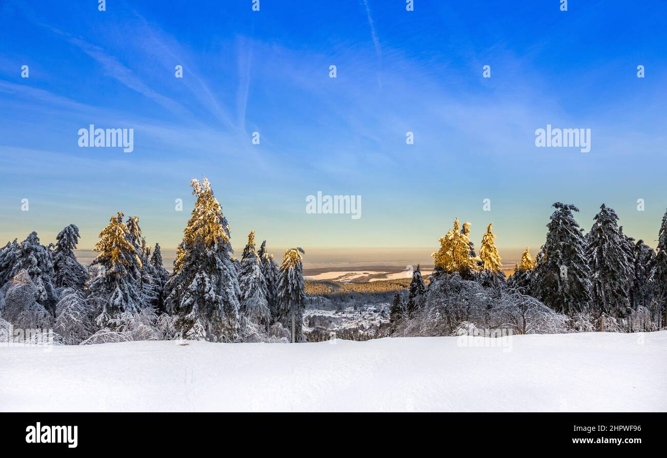 Sunshine under the winter calm mountain landscape with beautiful fir ...