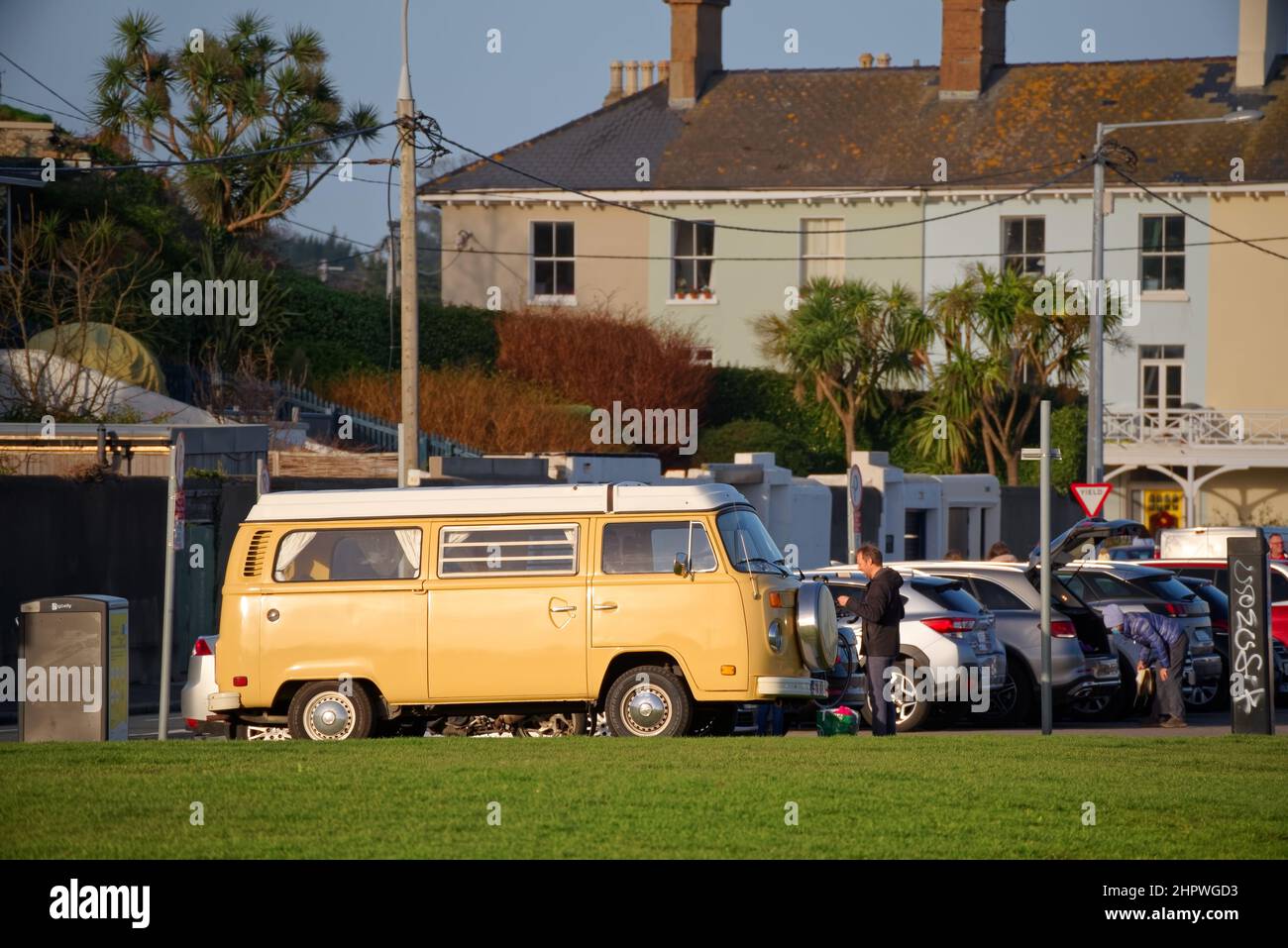 Classic yellow camper van parked at the street Stock Photo - Alamy