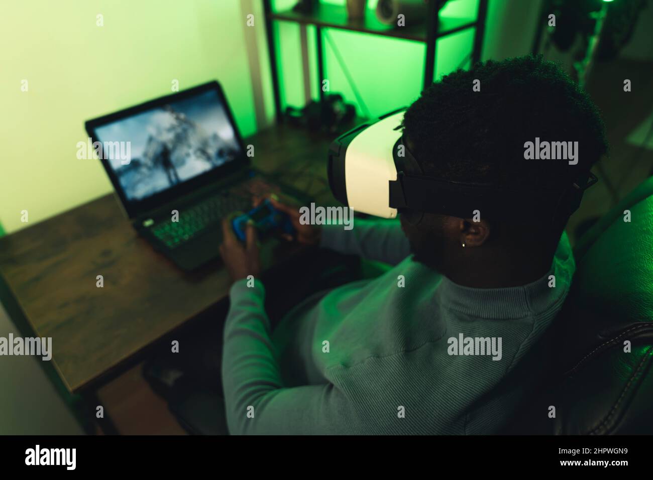 African American man playing in his room with VR headset - full shot ...