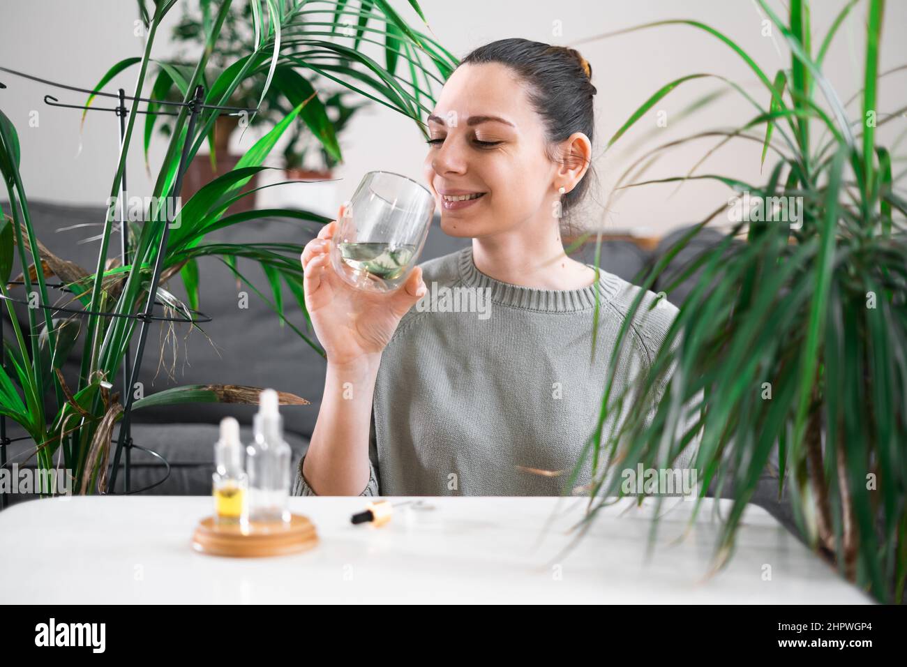 Woman drinking glass with Chlorophyll water, antioxidant beverage. Healthy lifestyle Stock Photo ...